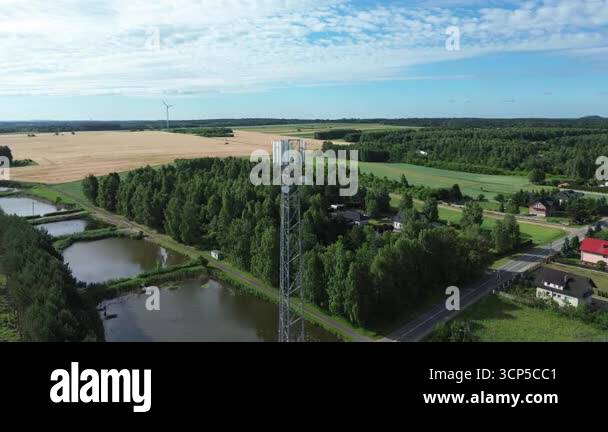 Metal cell tower rising in countryside Stock Video Footage - Alamy