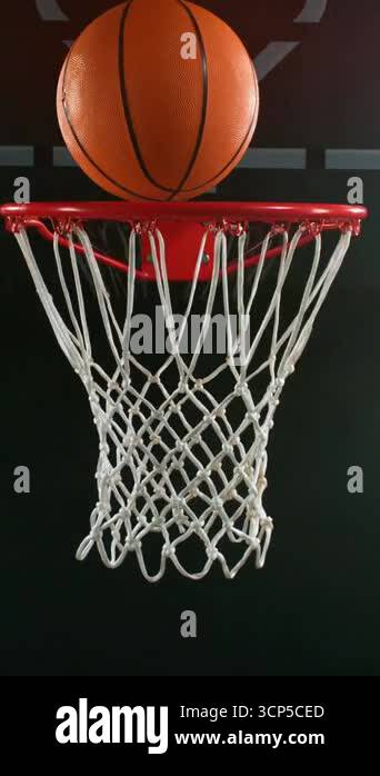 Super slow motion of basketball ball hitting the basket . Filmed on ...