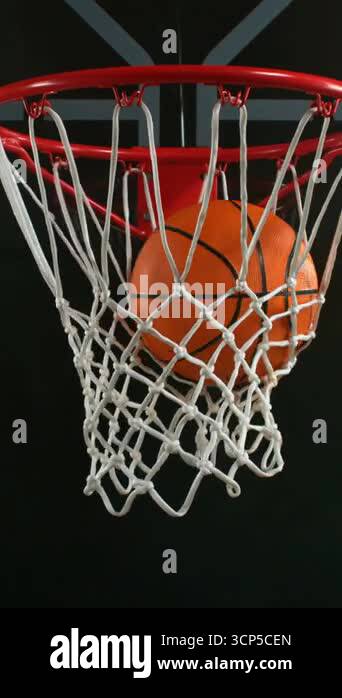 Super slow motion of basketball ball hitting the basket . Filmed on ...