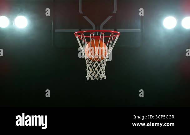 Super slow motion of basketball ball hitting the basket . Filmed on ...