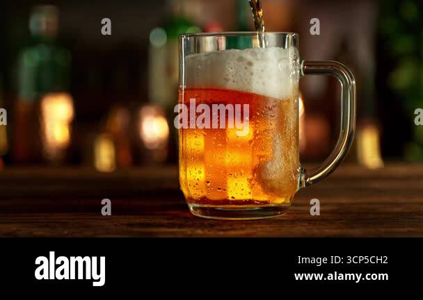 Super Slow Motion of Pouring Beer into Pint Glass, Camera Move. Filmed ...