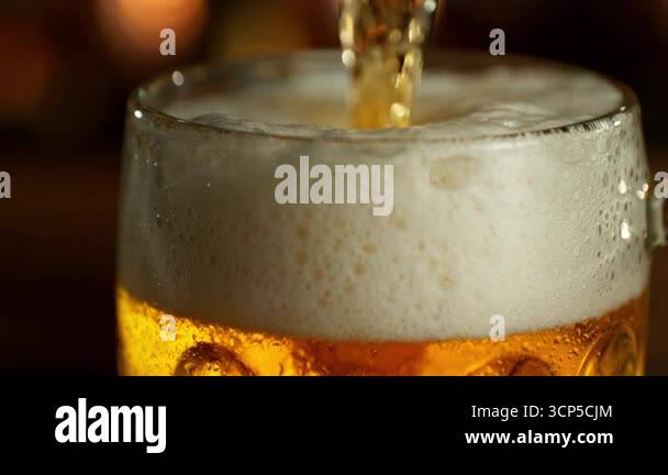 Super Slow Motion of Pouring Beer into Pint Glass, Camera Move. Filmed ...