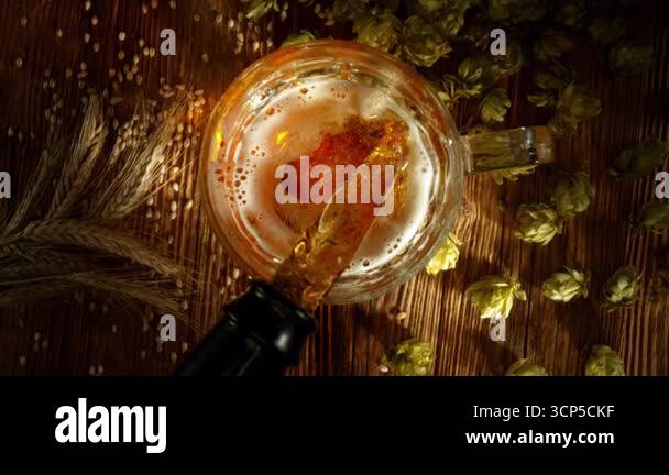 Super Slow Motion of Pouring Beer into Pint Glass, Top Down View ...