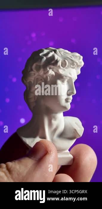 plaster head. small plaster bust in hands. Bust of a Greek man, classic ...