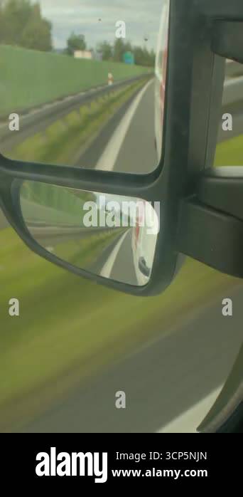 This video shows a cars reflective journey on a highway through ...