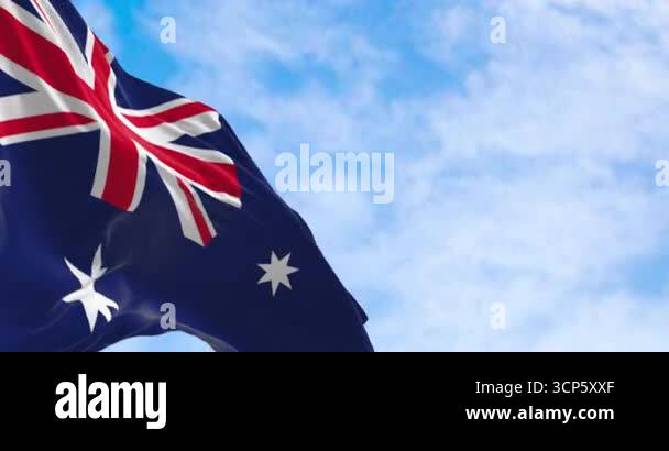 Australia national flag waving in the wind. Blue flag with Union Jack ...