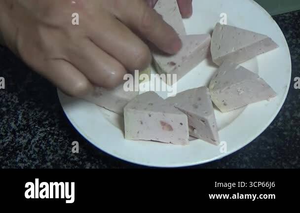 Slice Vietnamese ham into pieces and arrange on a plate Stock Video ...