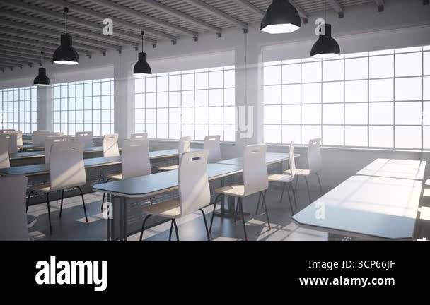 A slow pan across a modern, empty classroom with bright sunlight ...