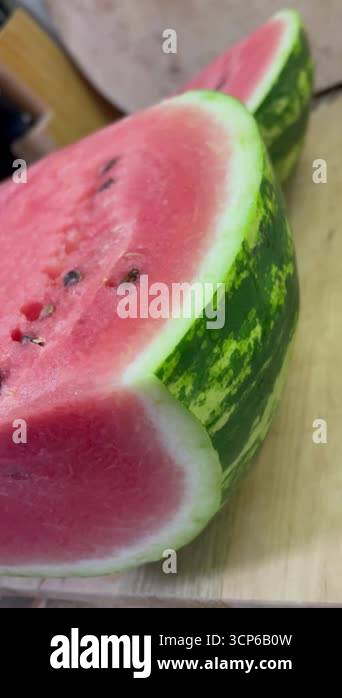 red appetizing juicy red watermelon on the table, fresh fruits and ...