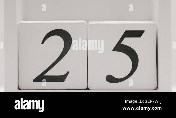 Close-up view of the number 25 in black text on a white background ...