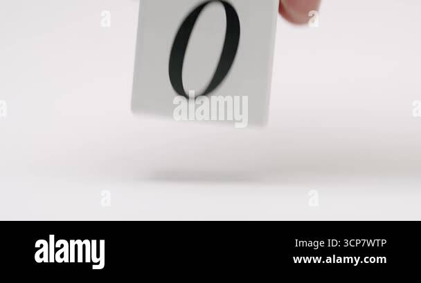 A minimalistic white block featuring a bold black number zero. Ideal ...