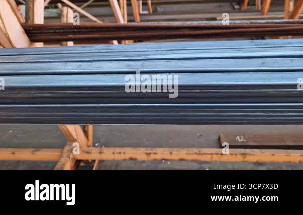 Rectangular steel profile pipes in a metal warehouse, selective focus ...