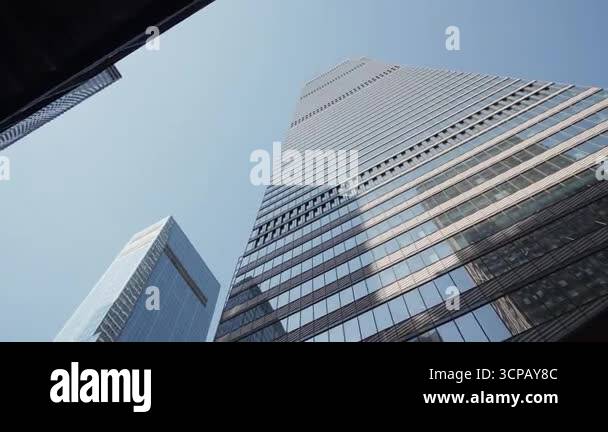A beautifully striking view of a tall modern skyscraper showcasing ...