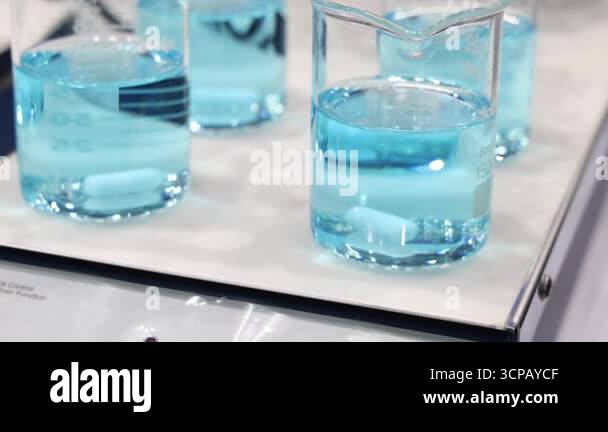Chemical liquids. Laboratory glassware with colorful chemical liquids ...
