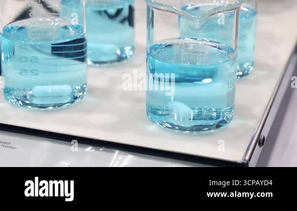 Chemical liquids. Laboratory glassware with colorful chemical liquids ...