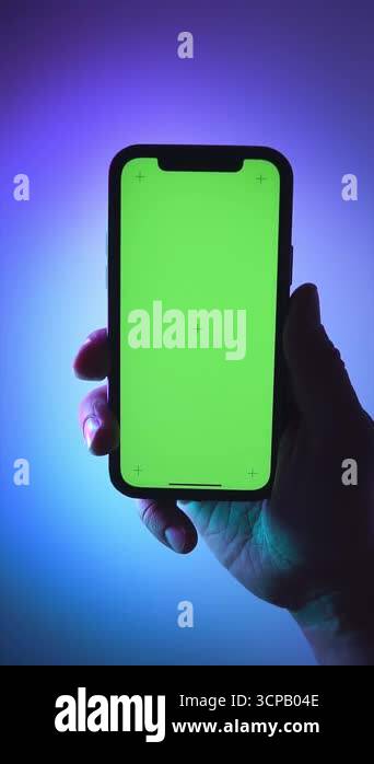Male hand Holding Mobile Phone with Green Chroma Key Screen Mockup ...