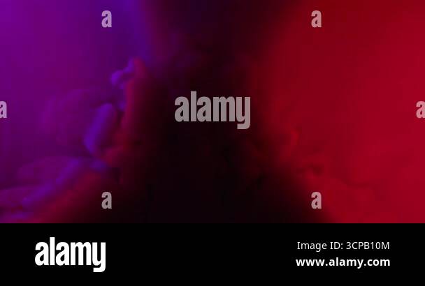 Color fog. Ink vapor. Dye wave flow on purple red light water. Fantasy ...