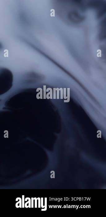 Vertical video. Wet texture. Stains art. Defocused blue color chemical ...
