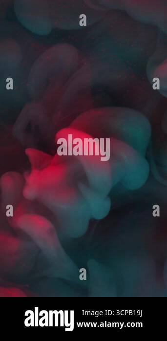 Vertical video. Fume explosion. Mystical paint. Gray red blue glossy ...