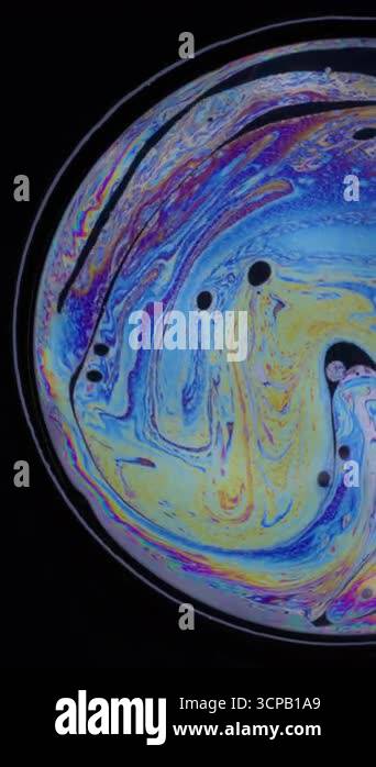 Vertical video. Multicolor liquid. Chaotic bubble. Neon oil paint blend ...