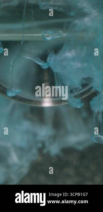 Vertical video. Gloss paint. Sphere background. Defocused blue color ...