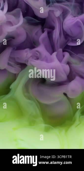 Vertical video. Vapor mix. Paint cloud. Color stream spray in water ...