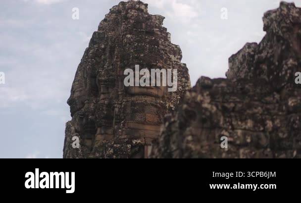 Smooth cinematic shot of Bayon Temple stone face at Angkor, Cambodia. High quality footage for ...