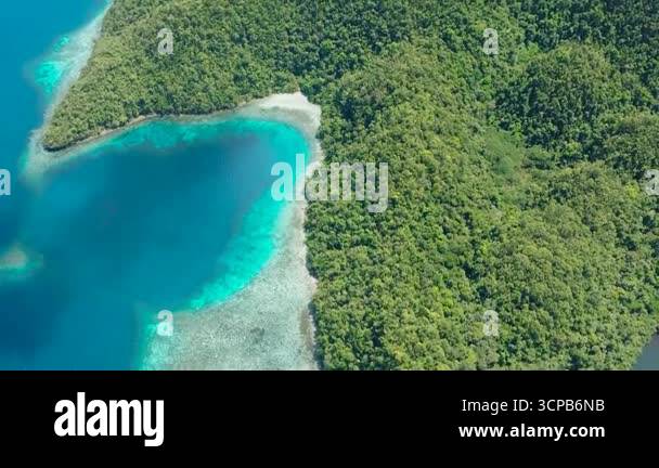 Rainforest and Lagoons in Sohoton Cove with turquoise lagoon surface on ...