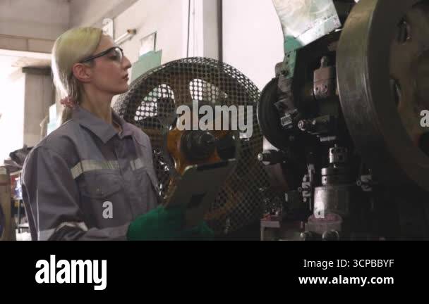 Caucasian technician woman beautiful wearing safety helmet earmuffs ...
