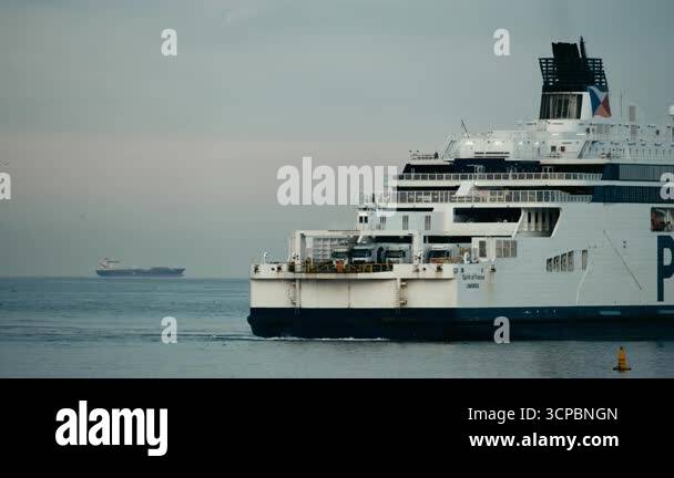 Close clip of stern of cross channel ferry as it turns inside the Port ...