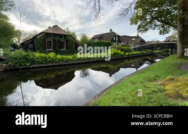 rural dutch traditional country small old town Giethoorn with canals ...
