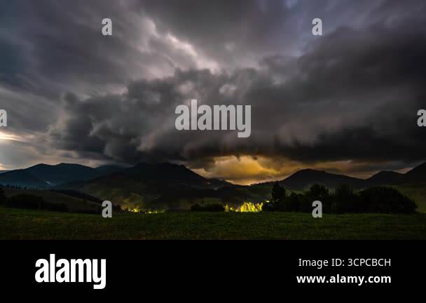 Dramatic stormy clouds gathering over countryside in the evening. Dark ...