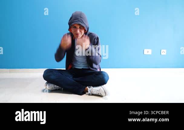 international autism awareness day- young man sitting with his back to ...