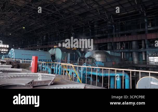 The engine turbine room of an old Soviet power plant. Steam turbine at ...