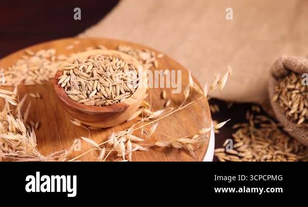 Oat grains in bowl and florets on table, closeup Stock Video Footage ...