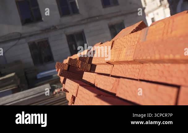 Bricks dominate foreground near silent decayed structure. Old building ...