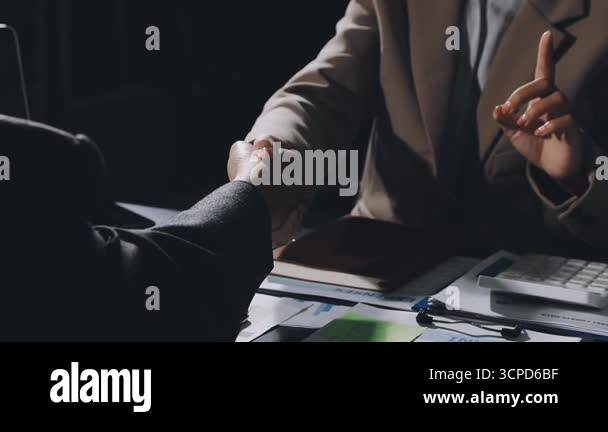 businessman shaking hands with a laptop in the office Stock Video ...