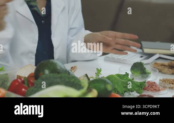 young doctor holding stethoscope and making a healthy plan in the ...