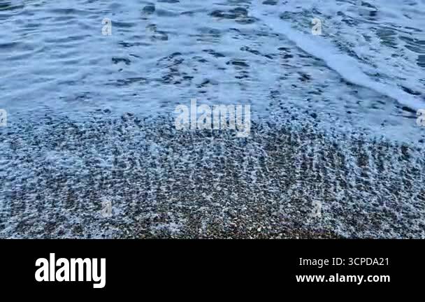 Experience the soothing calmness of ocean waves gently lapping against ...