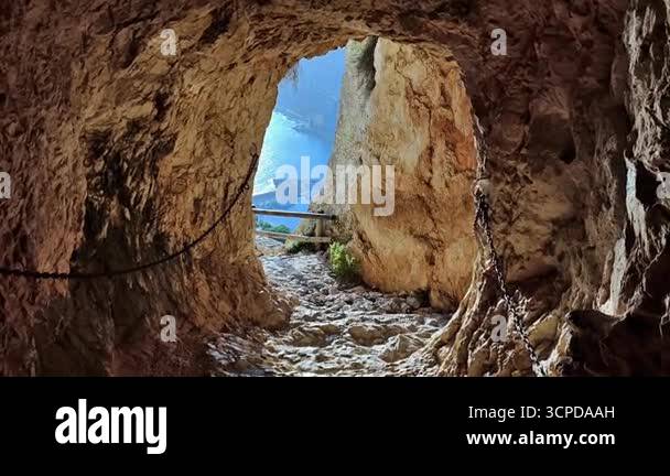The breathtaking view from the entrance of a cave reveals incredibly ...