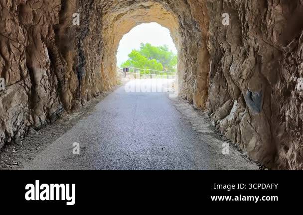 A stunningly beautiful tunnel entrance, featuring a perfectly paved ...