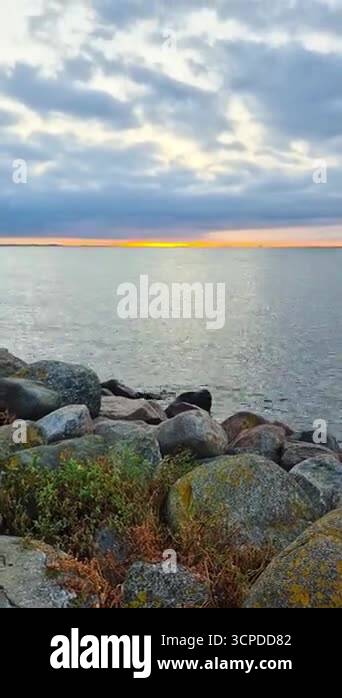 Immerse yourself in the calming beauty of a stunning sunset reflected ...