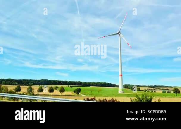 Wind turbines in a beautiful field, the concept of ecology. High ...