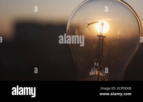 The sun's rays make their way through an incandescent light bulb ...