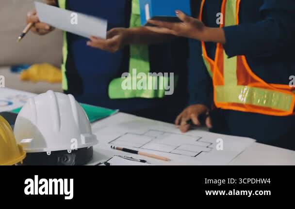 architect and engineer working at blueprint site project, engineer ...