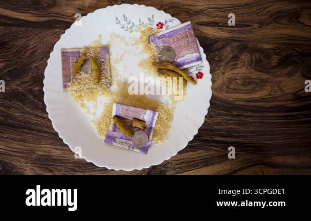 plate with money,raw haldi and rice so called hindu rituals shagun in ...