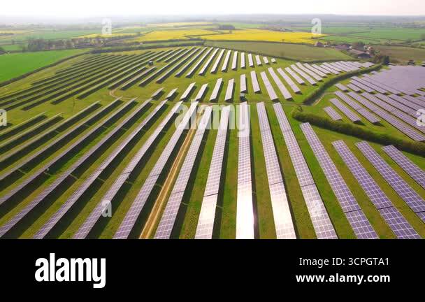 Aerial view of large solar panel arrays on a solar farm on adapted ...