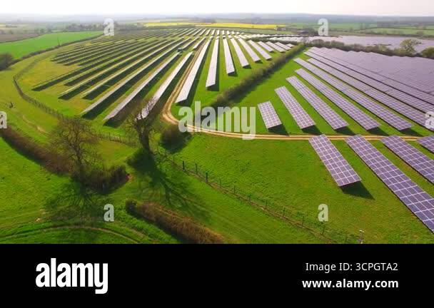 Aerial view of large solar panel arrays on a solar farm on adapted ...