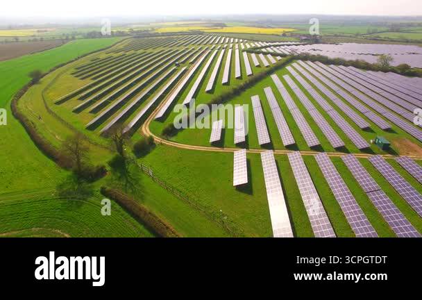 Aerial view of large solar panel arrays on a solar farm on adapted ...