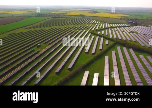 Aerial view of large solar panel arrays on a solar farm on adapted ...
